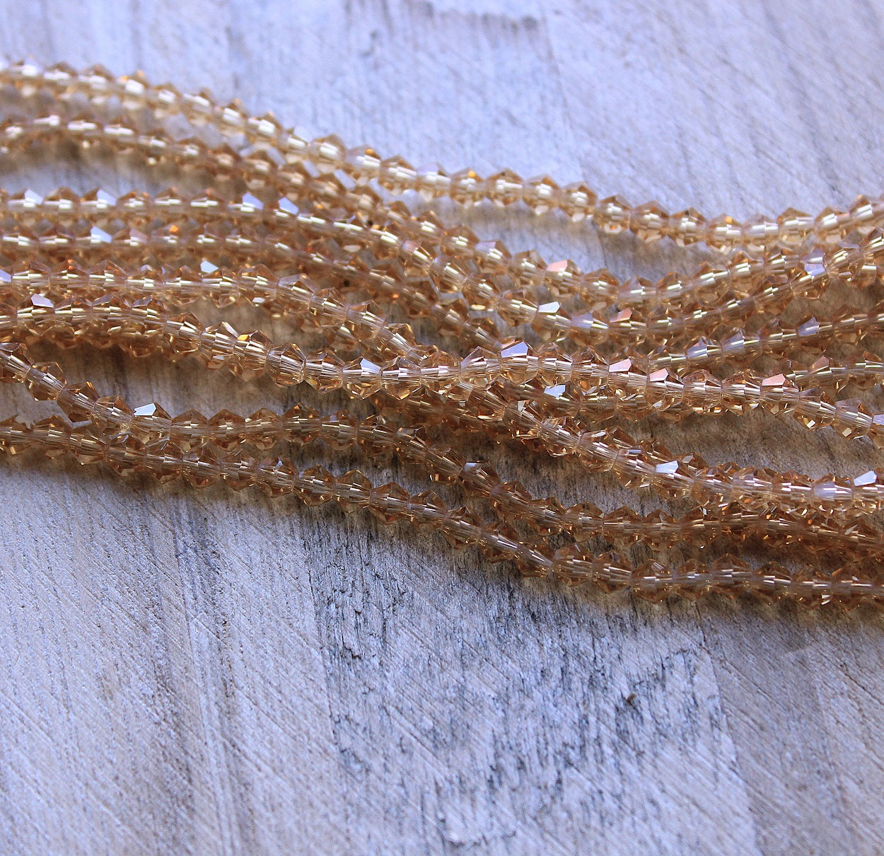 The Bead Store 4mm Glass Bicones Gold approx. 80 beads